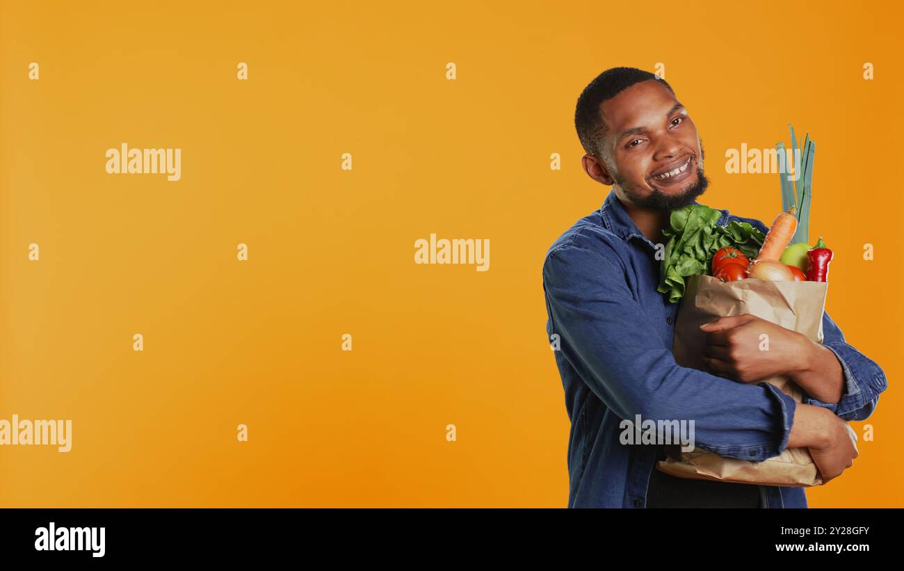 Male model hugging paper bag hi-res stock photography and images - Alamy