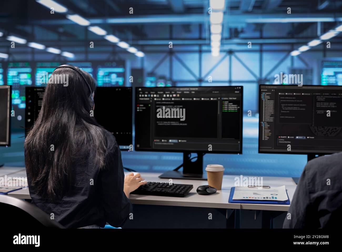 Software developer checking for signs of imminent failure in data ...