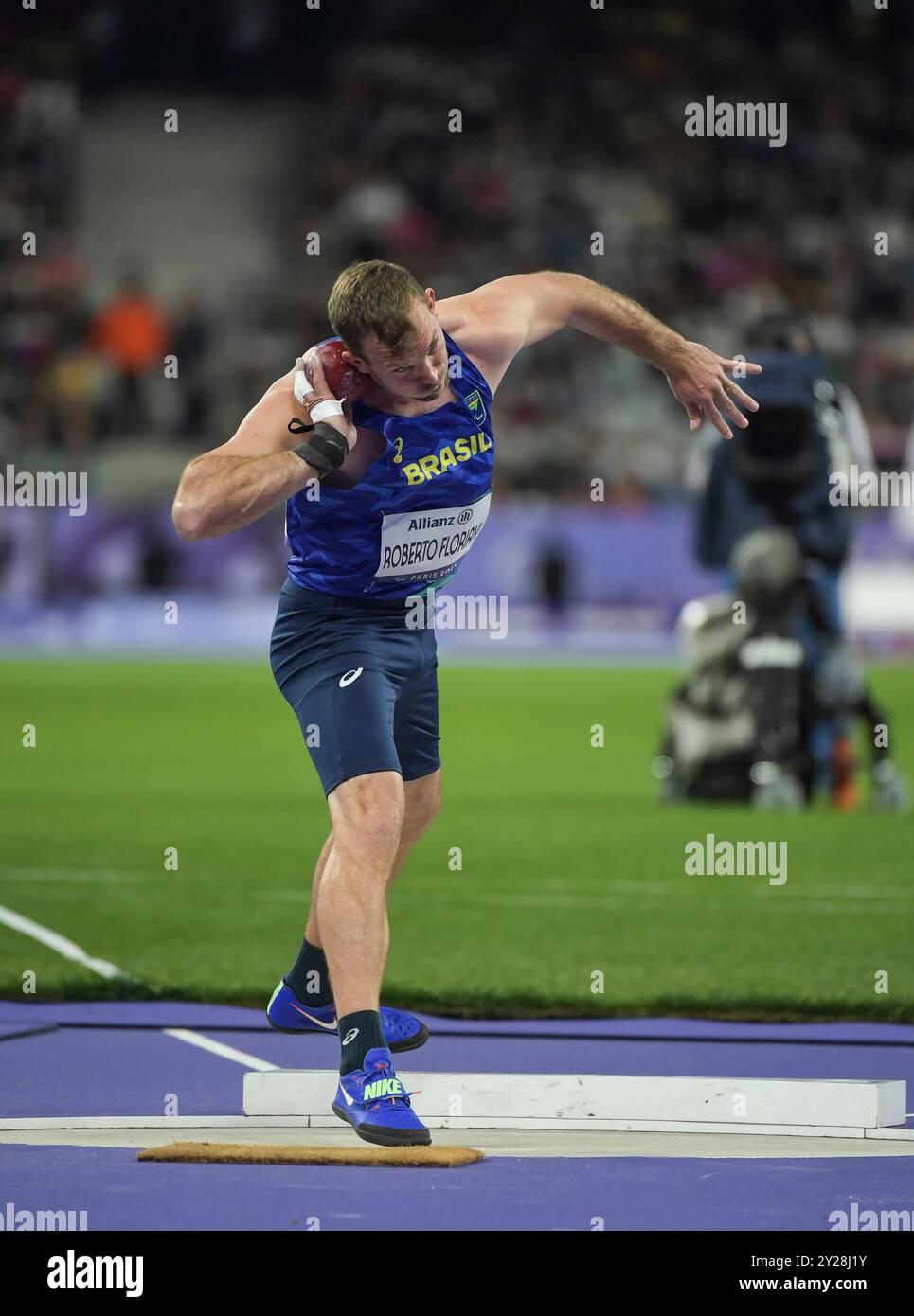 Edenilson Roberto Floriani of Brazil competing in the men F63 shot put ...