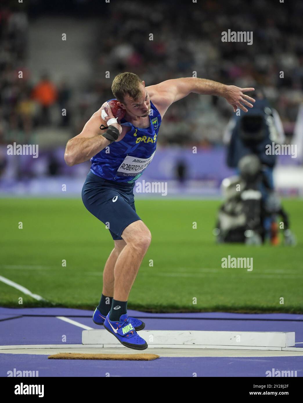 Edenilson Roberto Floriani of Brazil competing in the men F63 shot put ...