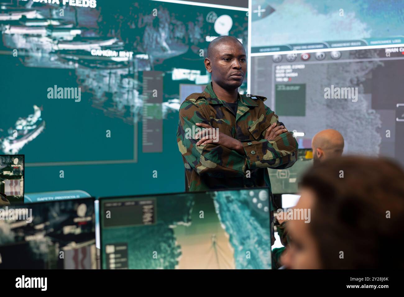 Portrait of army commander in military camouflage uniform supervising ...