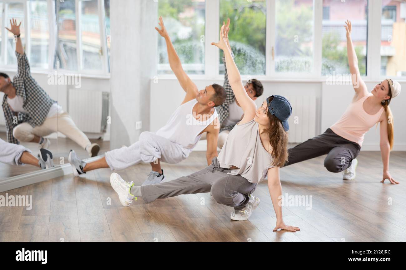 Young girl practicing breakdance floor-works in training hall Stock Photo - Alamy
