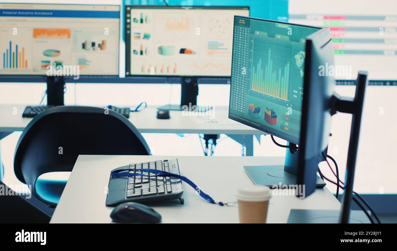 Empty telecommunications control room with workstations, coworking ...