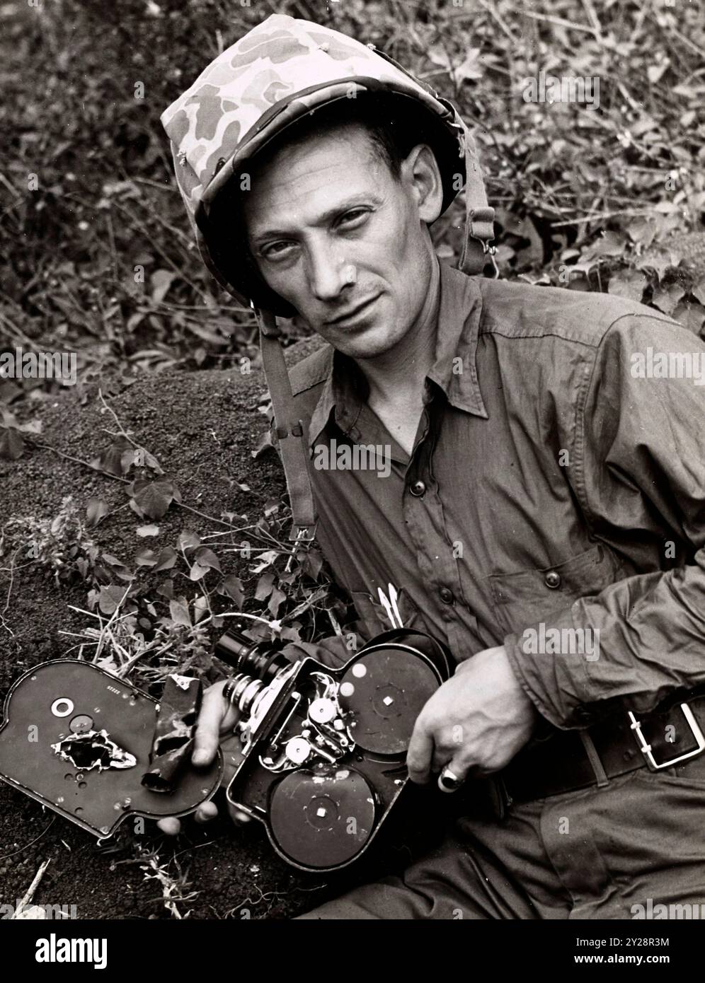 Original caption: Coast Guard Combat Photographer Charles W. Bossert ...
