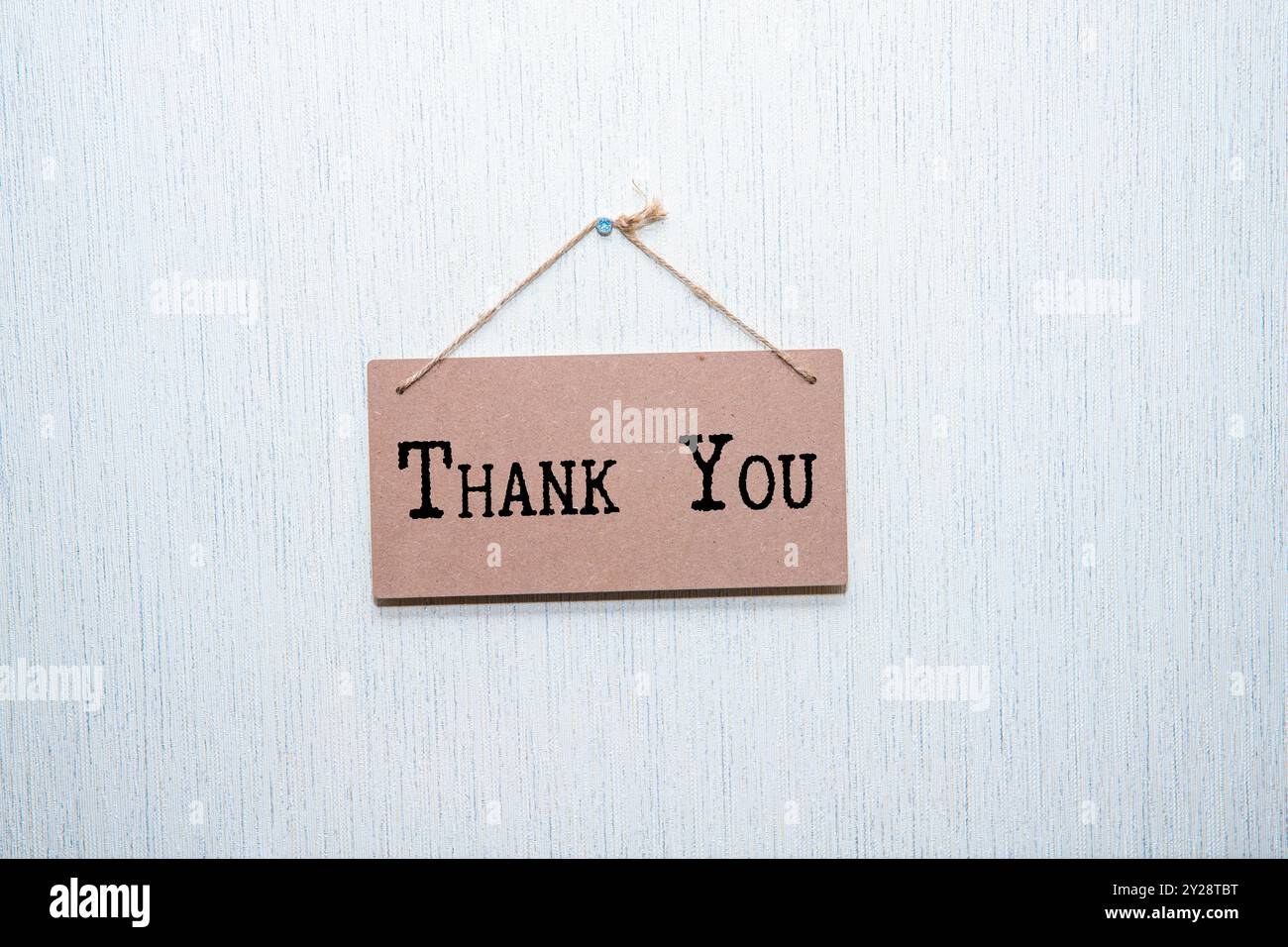 Thank you message written on ripped pink torn paper piece with cardboard background Stock Photo ...