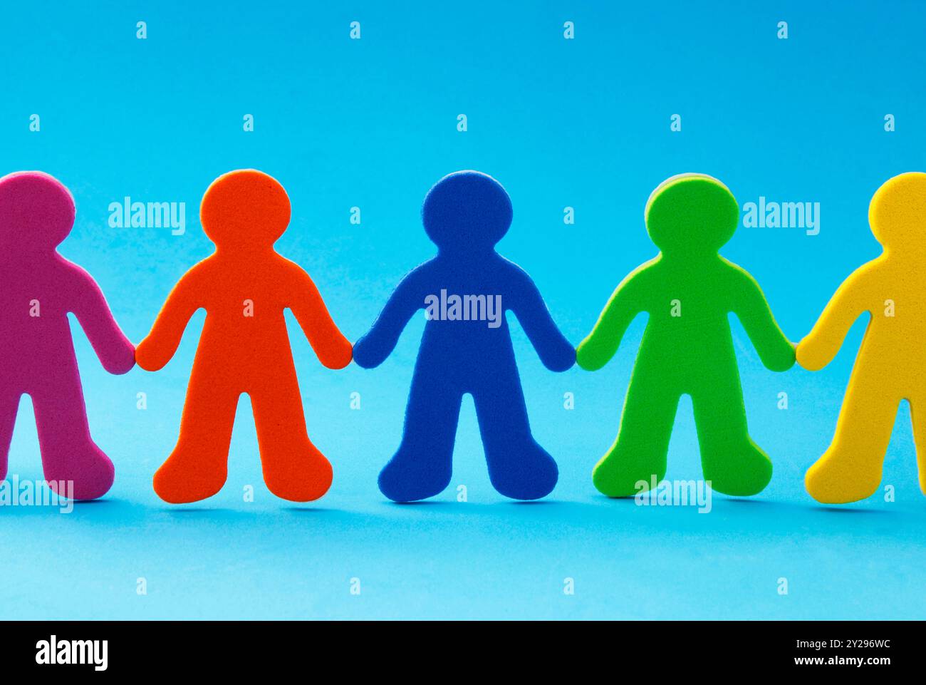 Colorful silhouettes of people forming a row Stock Photo - Alamy