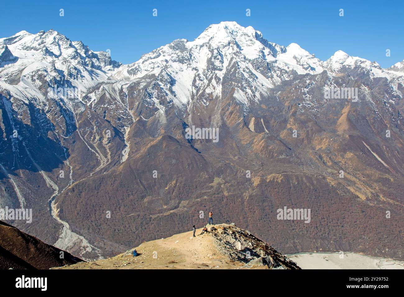 Trekkers on the slopes of Tsergo Ri above the Langtang Valley Stock ...