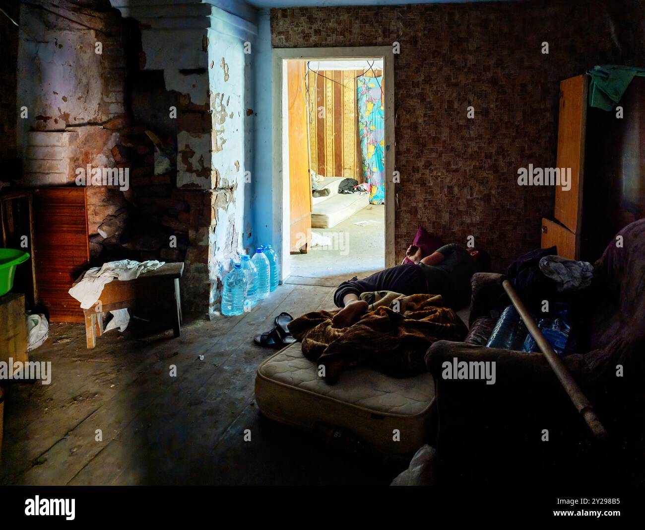 Homeless people sleeping in abandoned house Stock Photo - Alamy