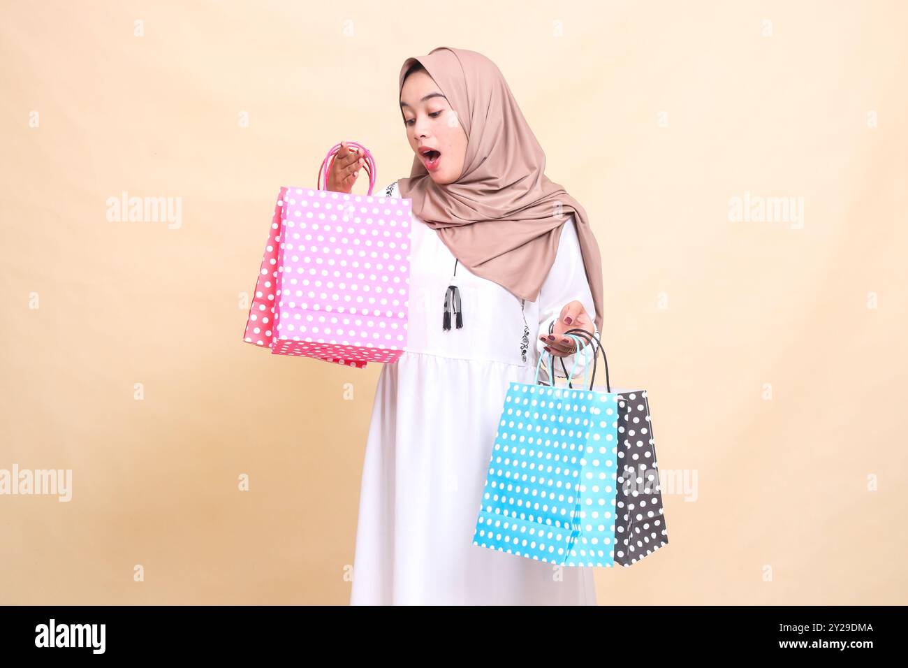 The charm of a young Asian Muslim woman wearing a hijab was shocked to ...