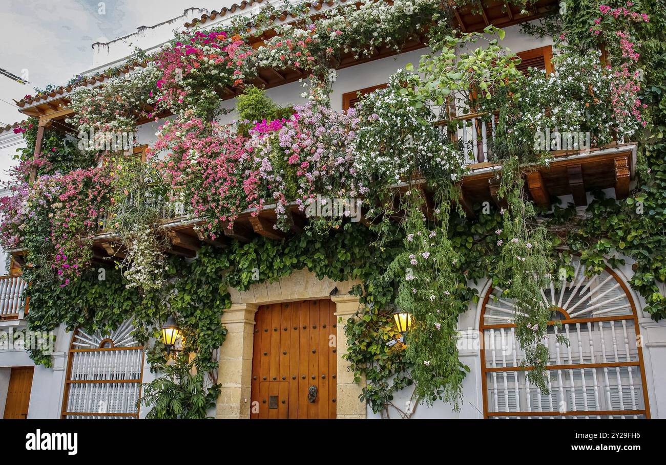 Low angel view of a traditional building with wooden balcony and green ...