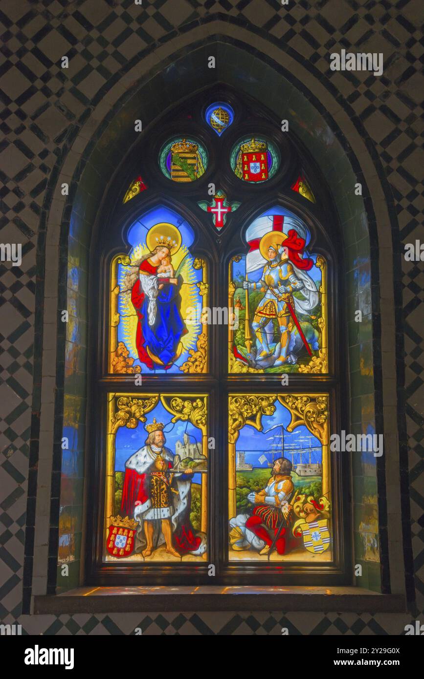 A colourful stained glass window with religious and medieval scenes ...