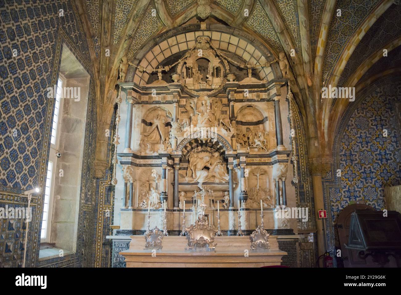 Decorative interior of a church with elaborately decorated altar and ...
