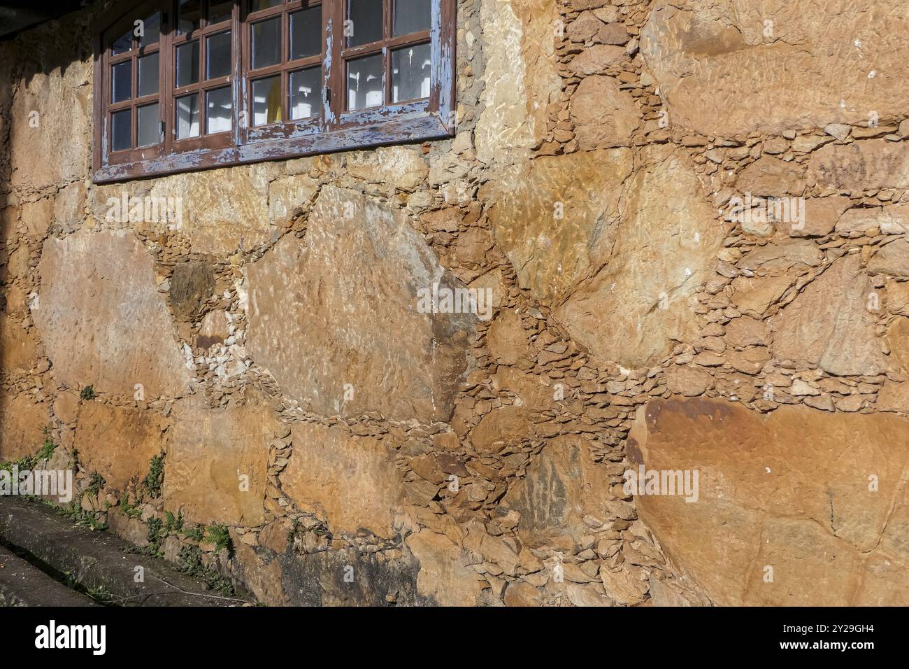 Typical sandstone wall of an old colonial building with window, Minas ...