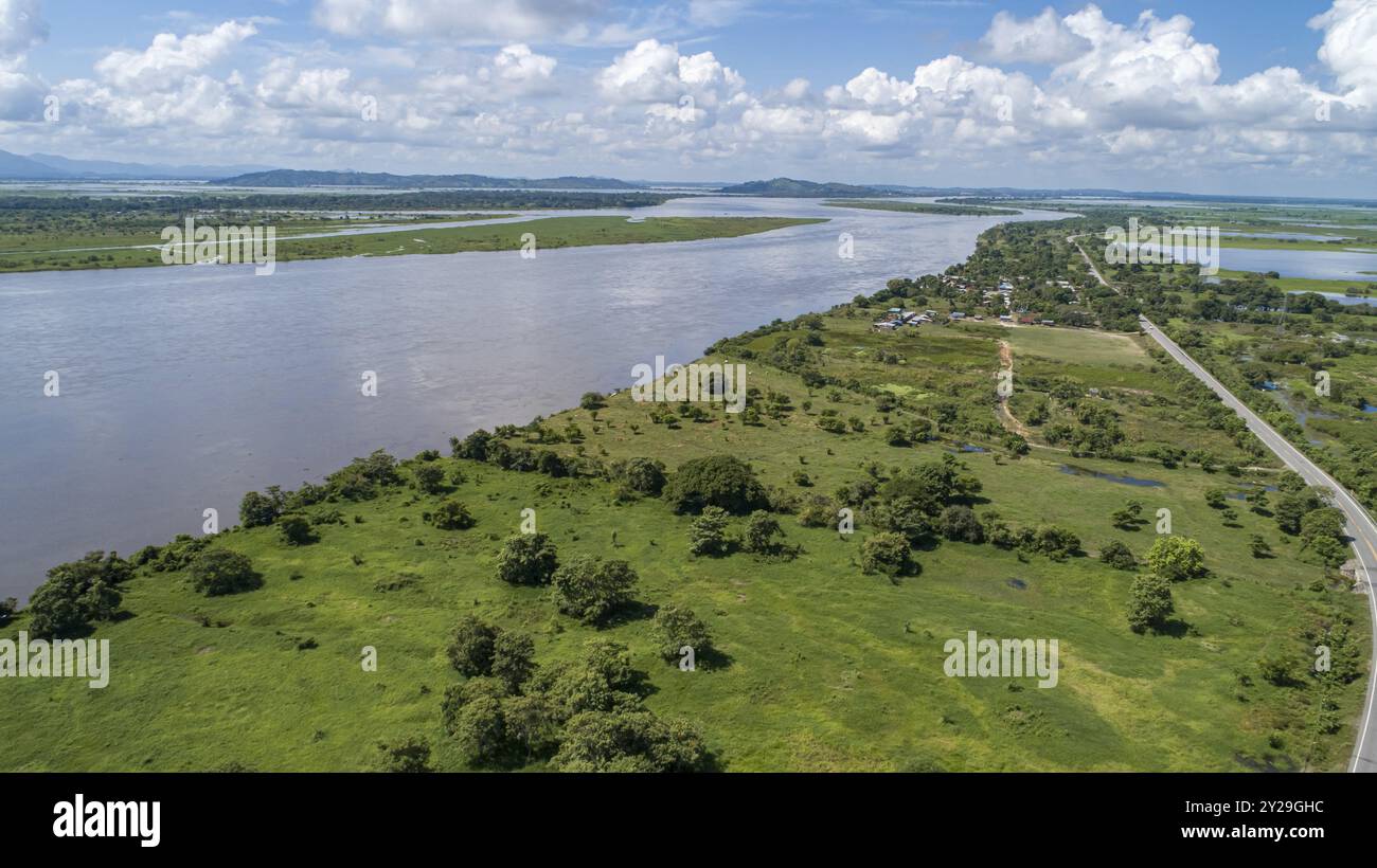 Aerial view Magdalena River and green rural landscape with blue sky and ...