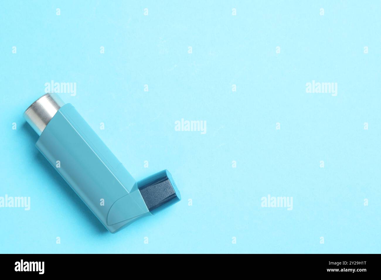Asthma inhaler on light blue background, top view. Space for text Stock ...