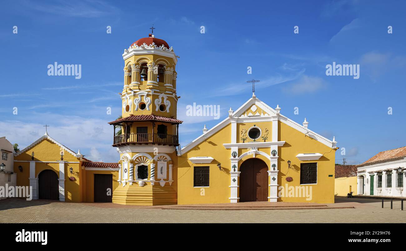 View to beautiful historic Church Santa Barbara Santa Cruz de Mompox, sunlight and blue sky ...