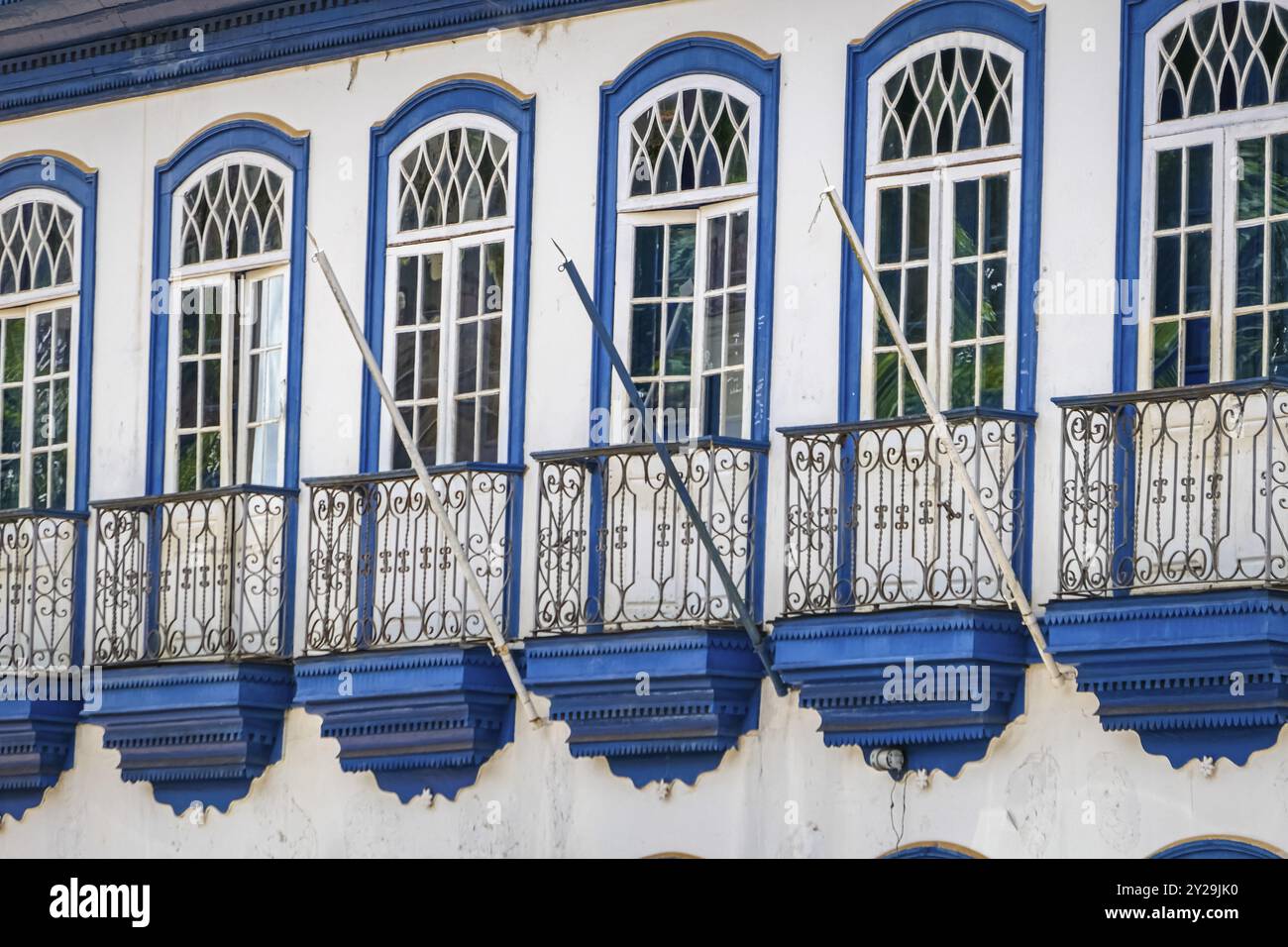 Close-up of historic house facade with windows and balustrades in white ...
