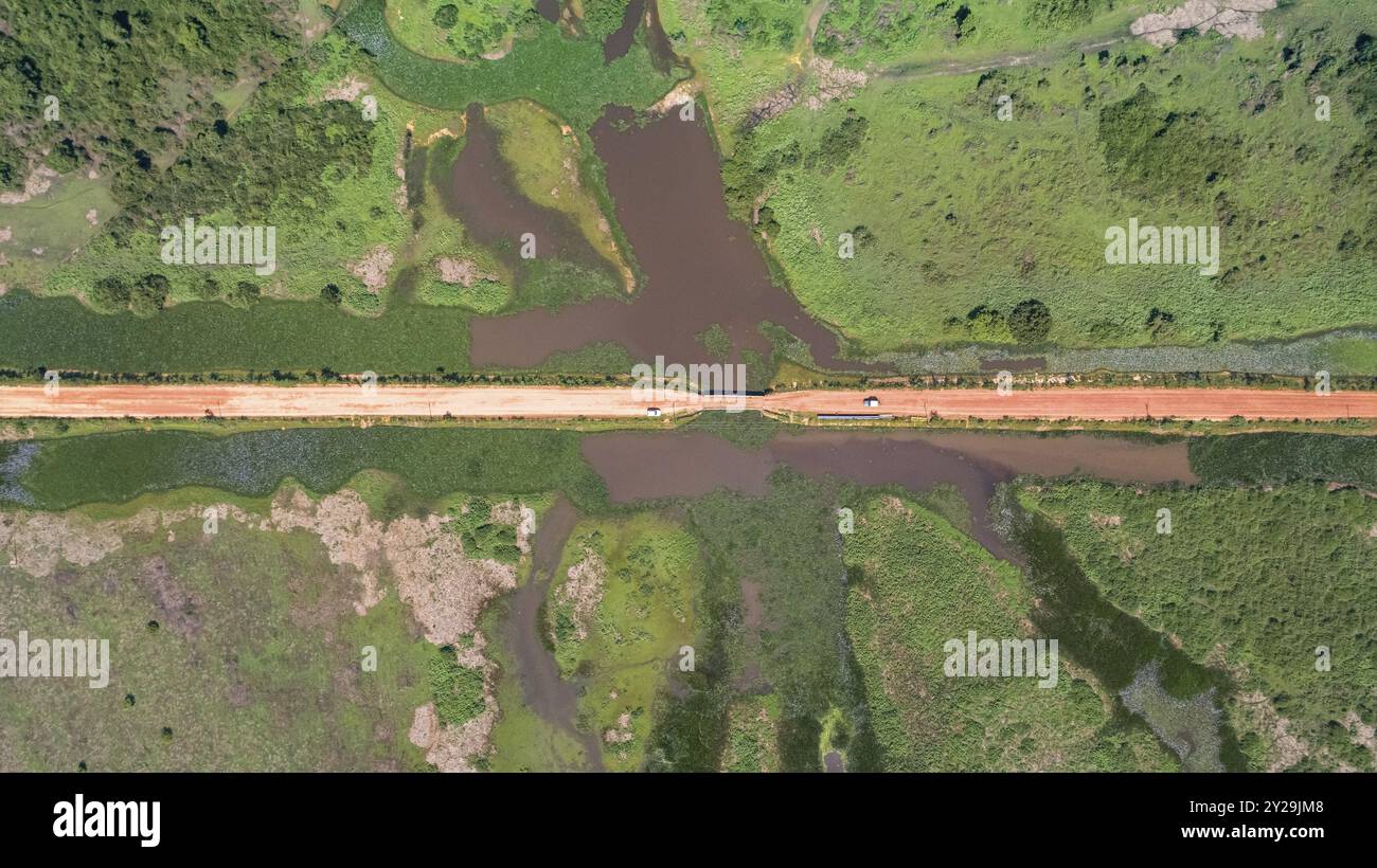 Aerial view of Transpantaneira dirt road crossing in typical Pantanal ...