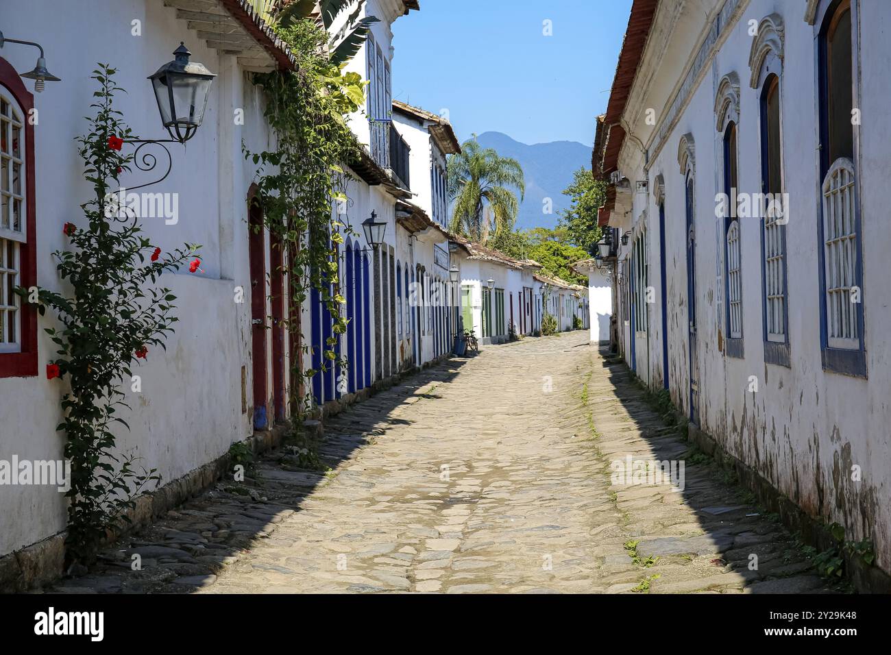 View to mountain through a typical cobblestone street with colonial ...