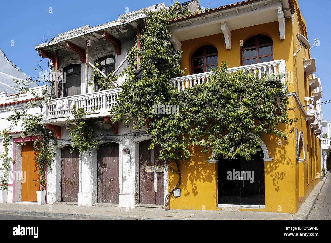 Typical buildings with balconies covered with plants in Old Town ...