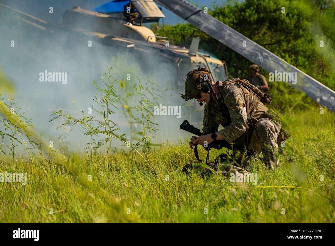 A U.S. Air Force explosive ordnance disposal technician applies a ...