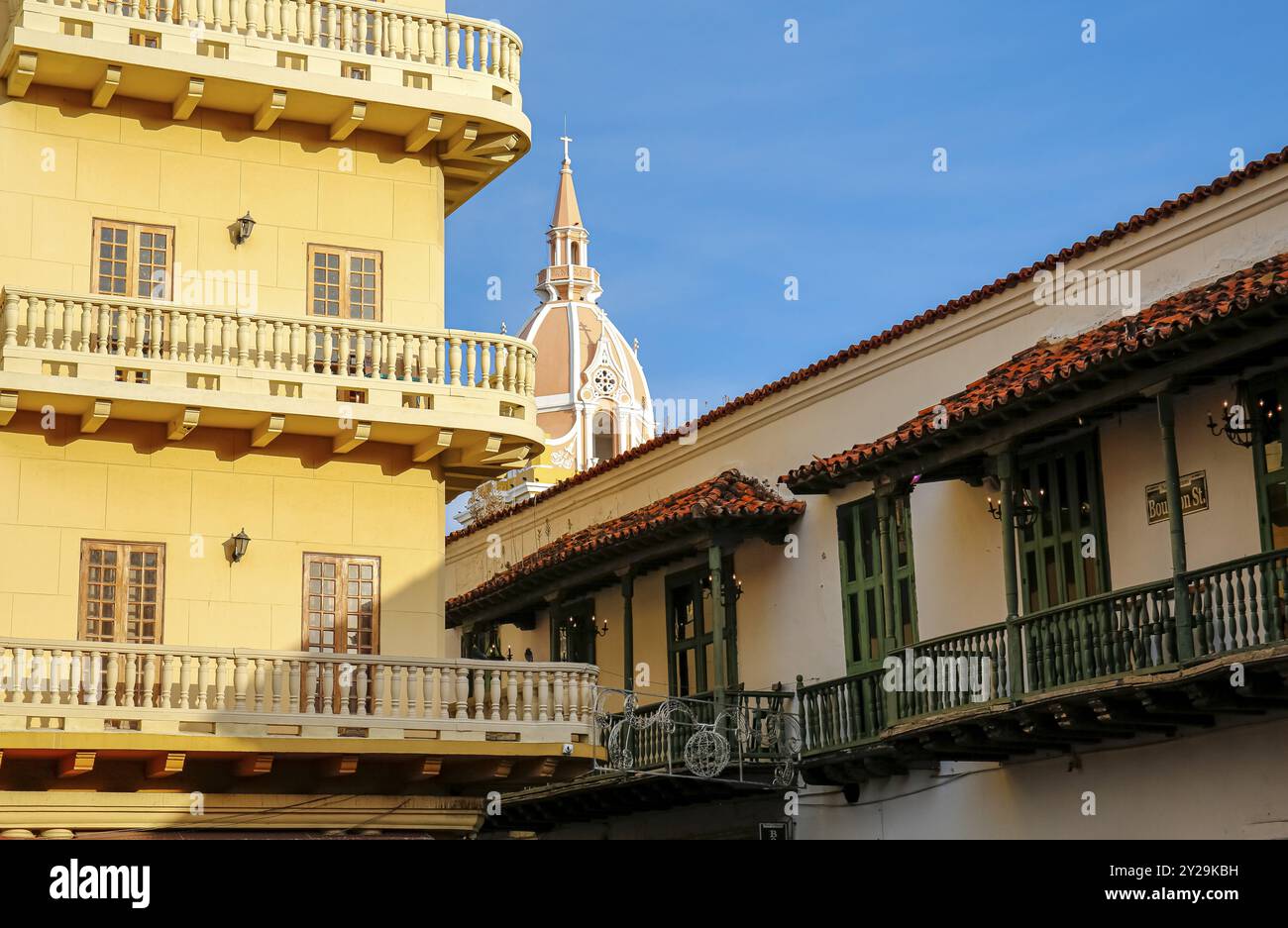 View to historic buildings with balconies, cathedral spire in the back ...