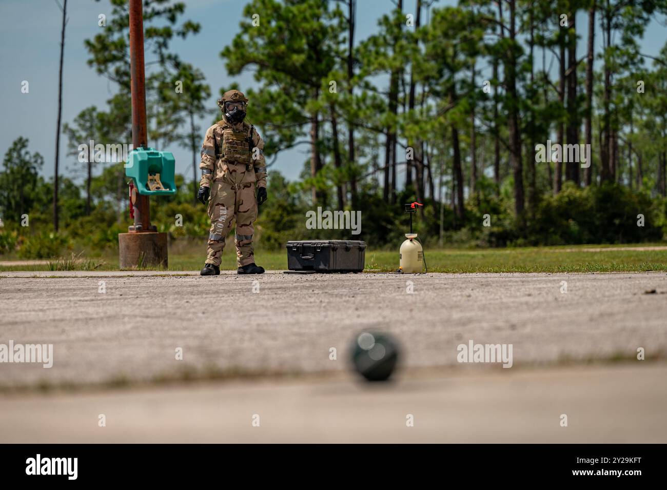 A U.S. Air Force explosive ordnance disposal technician assesses an ...
