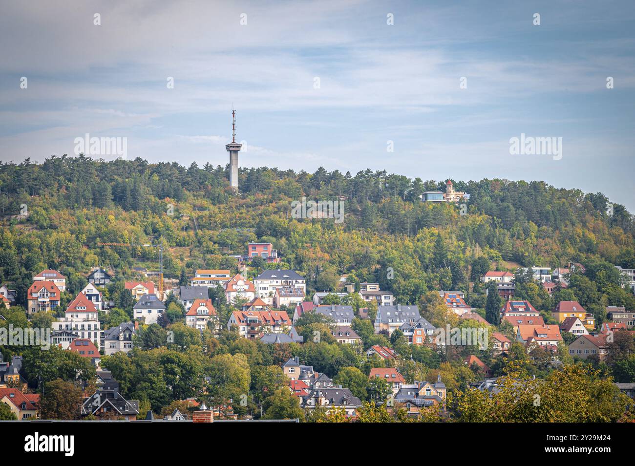 The western district of Jena on the wooded hill with colourful rooftops ...
