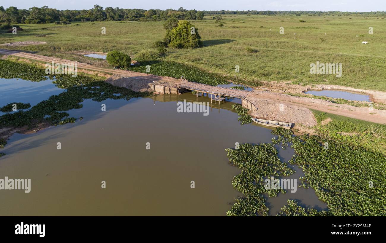 Aerial view of a bridge over a lagoon in typical rural landscape of ...