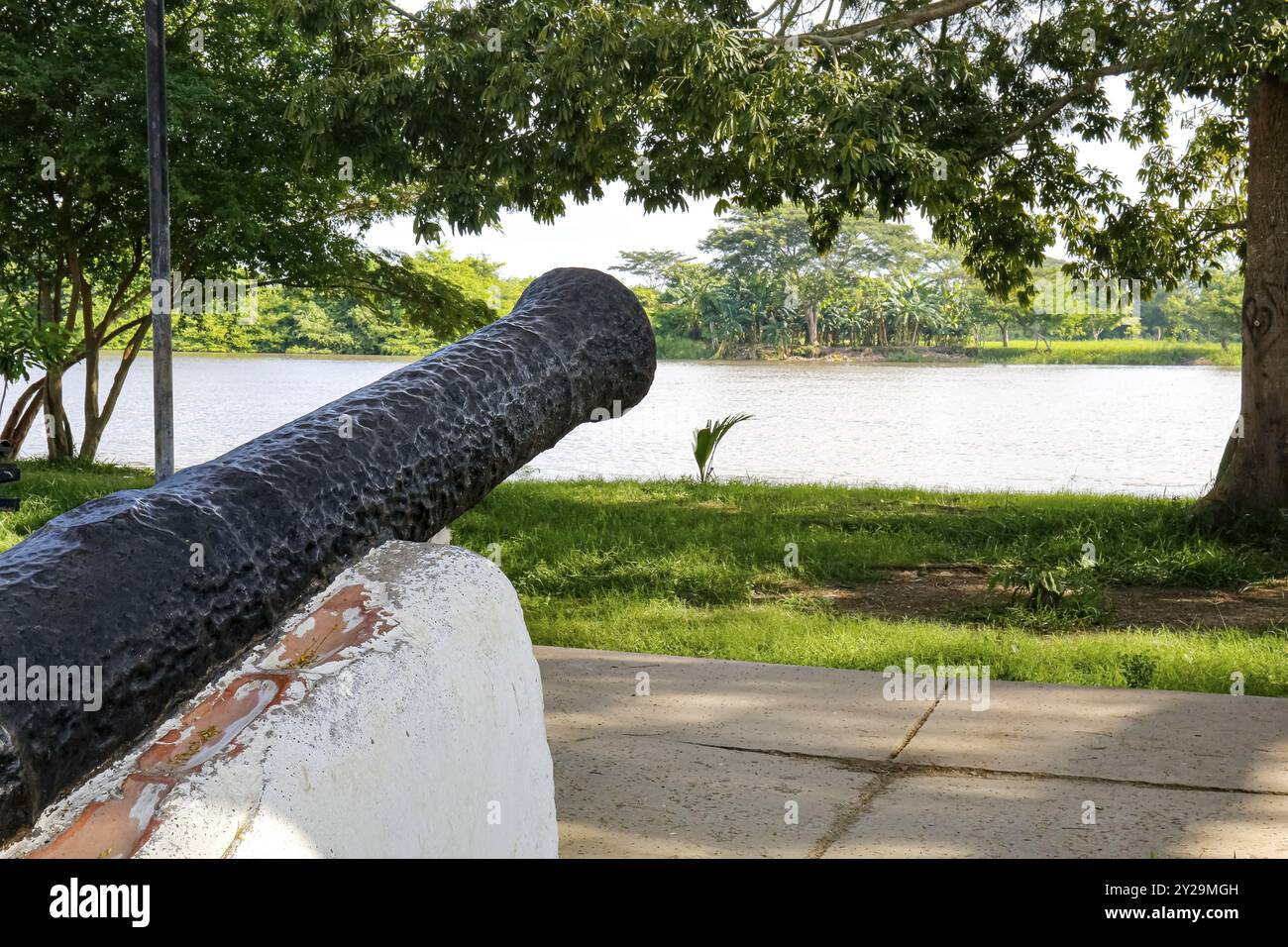 Old cannon at the river promenade in historic town Santa Cruz de Mompox ...