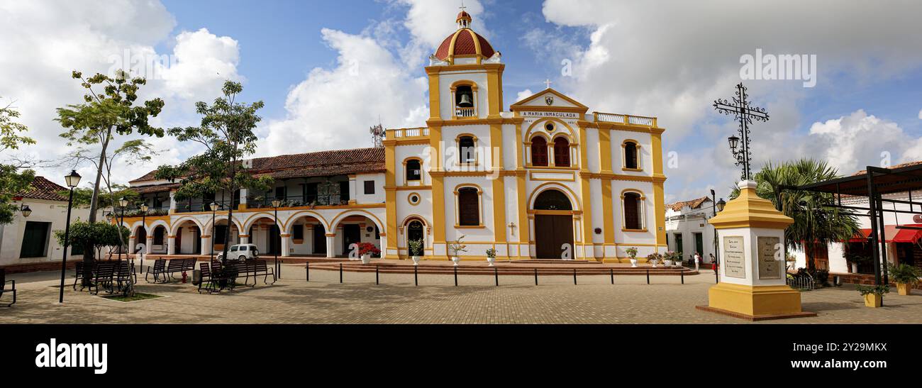 Typical street with white historic buildings in sun and shadow of Santa ...