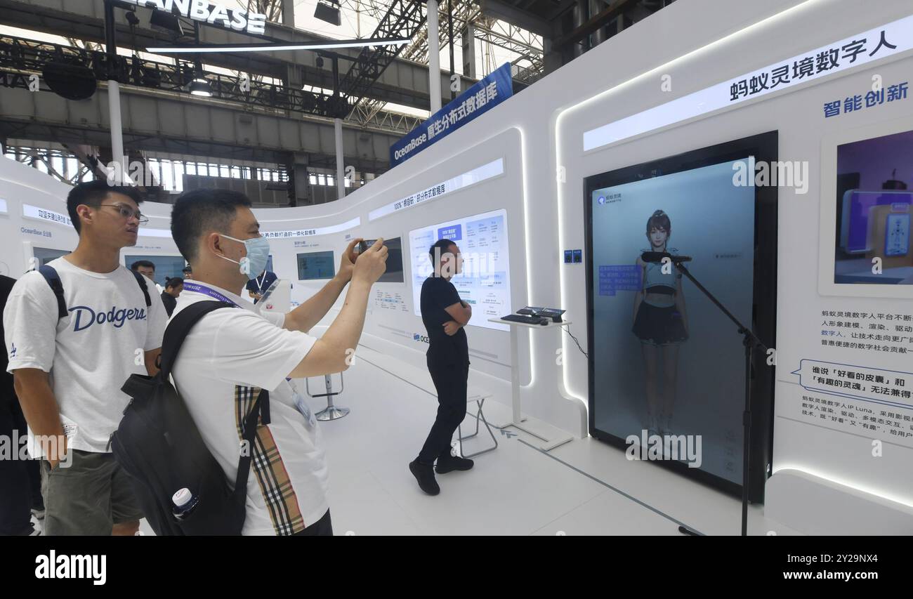 SHANGHAI, CHINA - SEPTEMBER 5, 2024 - Visitors interact with Ant Group ...