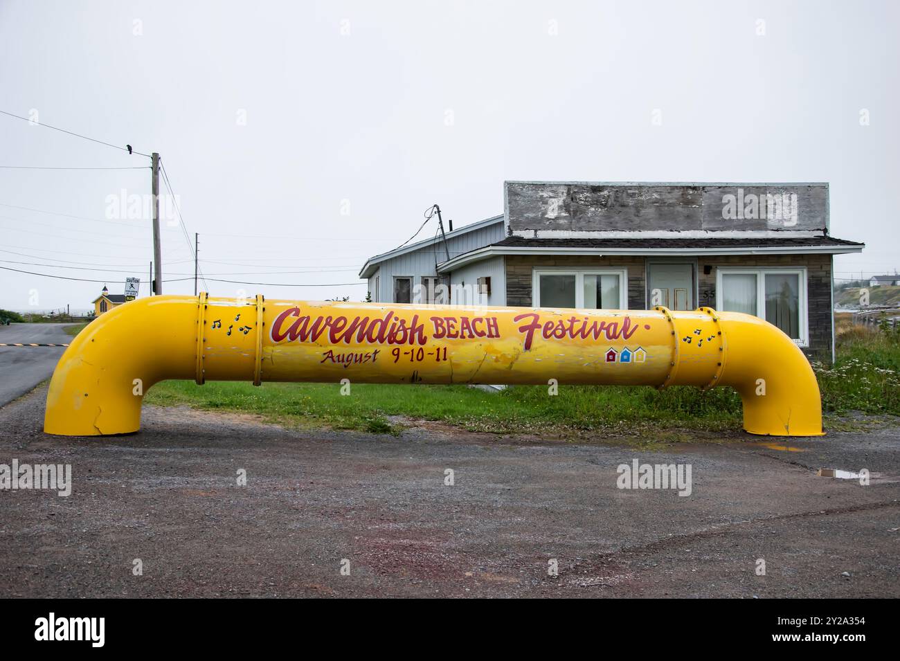 Sign on a pipe advertising a beach festival in Cavendish, Newfoundland ...
