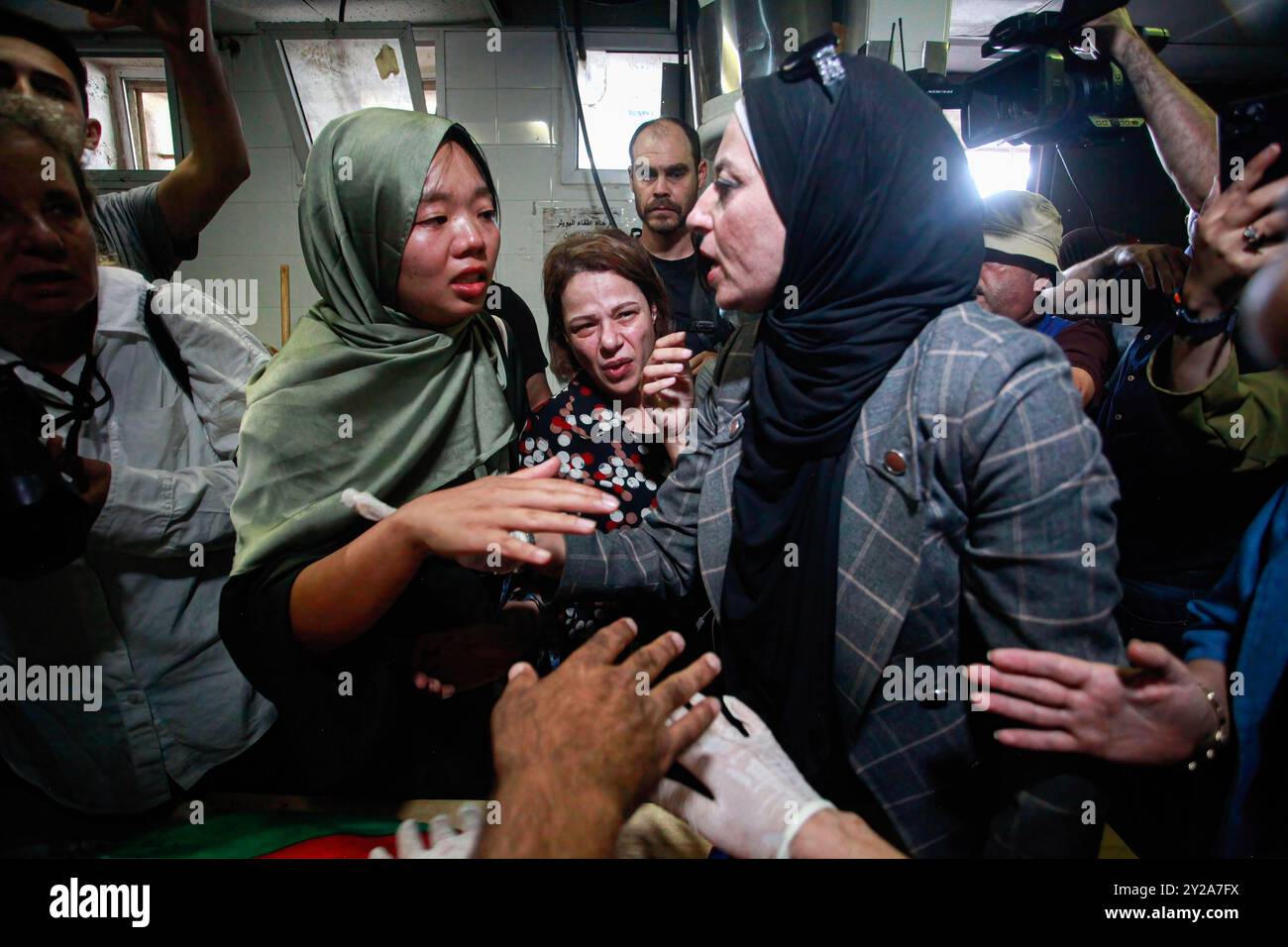 Nablus, Palestine. 08th Sep, 2024. Friends and relatives mourn the body of slain Turkish ...