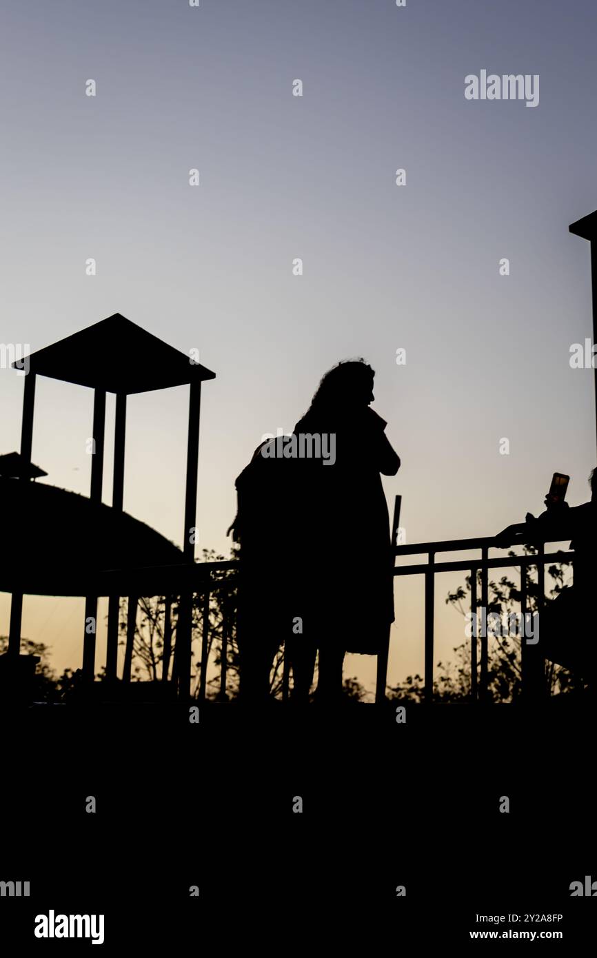 Lady watching sunrise hi-res stock photography and images - Alamy