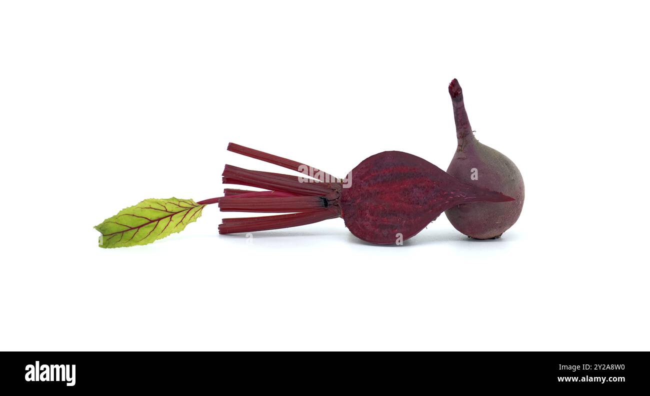 Fresh beetroot with vibrant red color and green leaves on a white ...