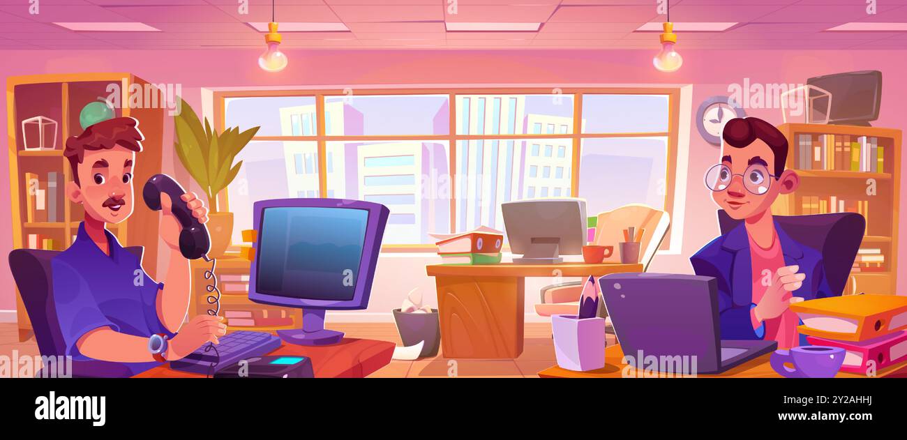 Two men working at table in office room interior with computers and ...