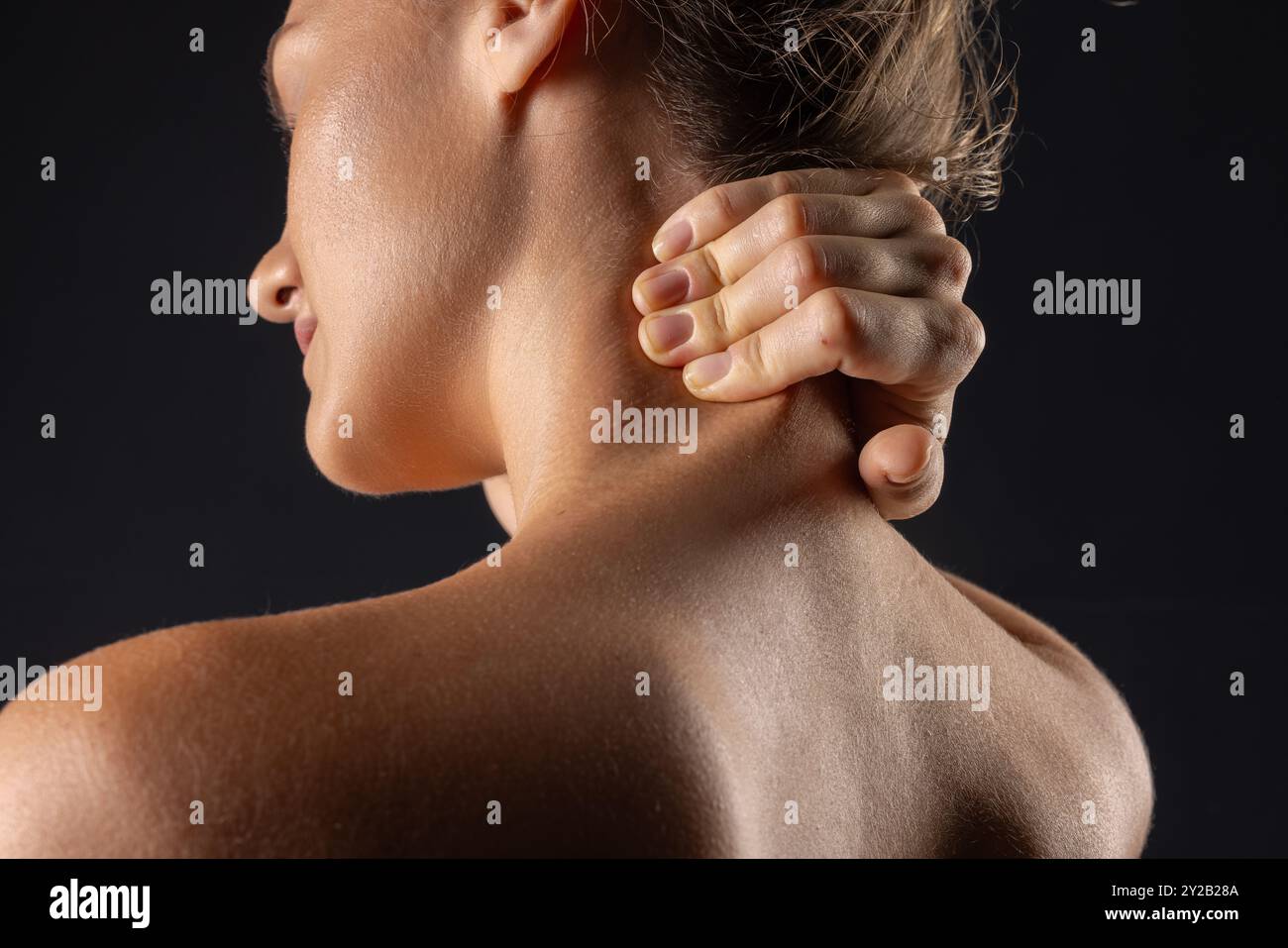 woman massaging neck close-up, concept of neck pain with ...