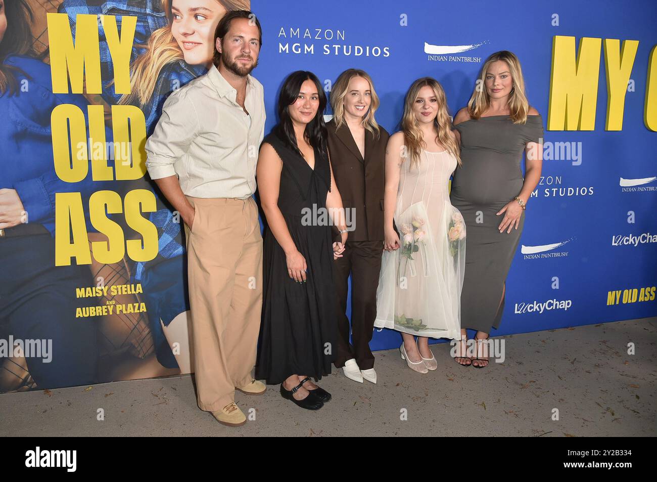 Tom Ackerley, from left, Bronte Payne, Megan Park, Maisy Stella, and Margot Robbie arrive at the ...