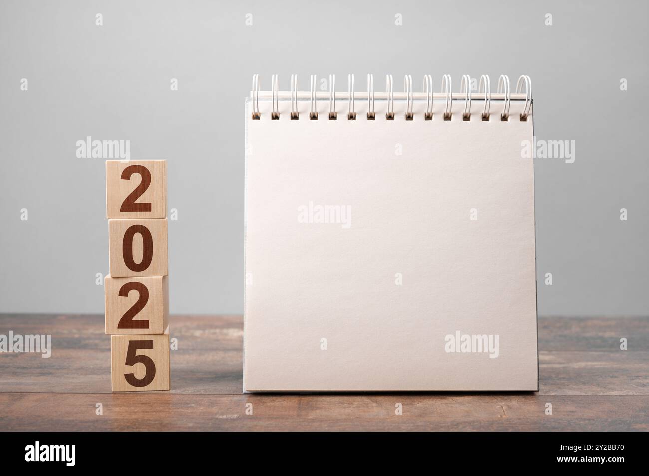 2025 mockup notepad. 2025 cubes wooden table background. New Year ...
