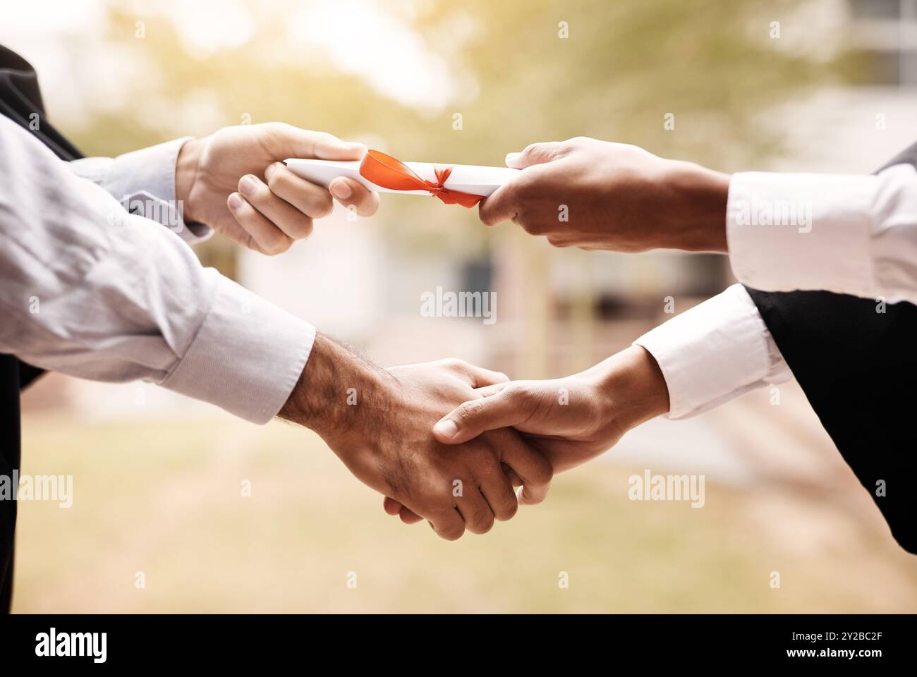 People, student or qualification with handshake for graduation ...