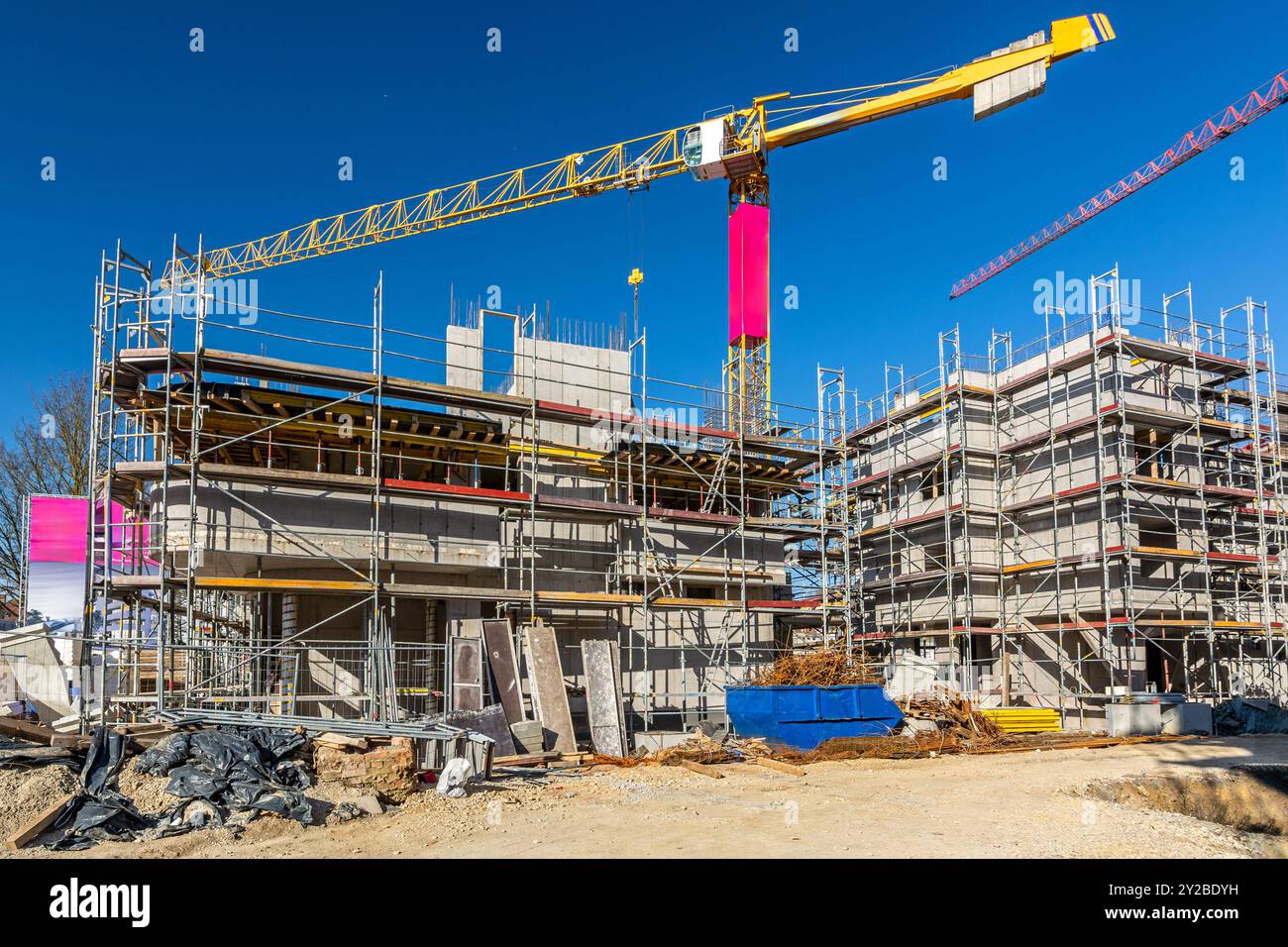 Construction site with crane, scaffolding and shell of an unfinished ...