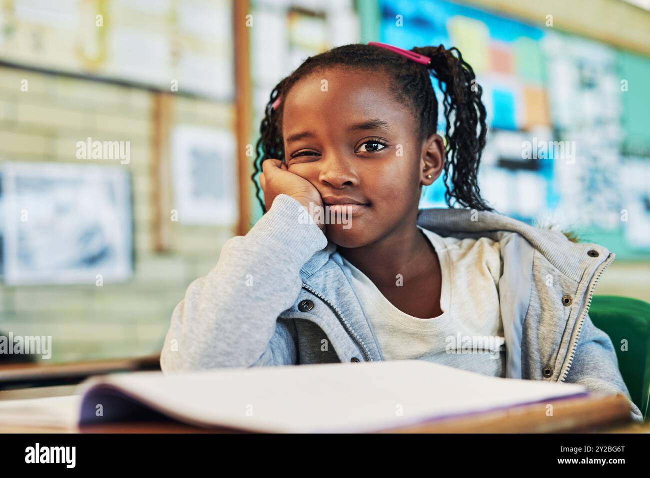 Bored, portrait and black kid in classroom at elementary school in ...