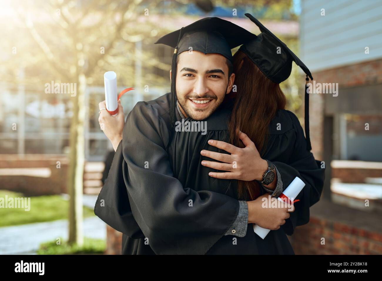 Happy, students and hug for graduation celebration, education ...