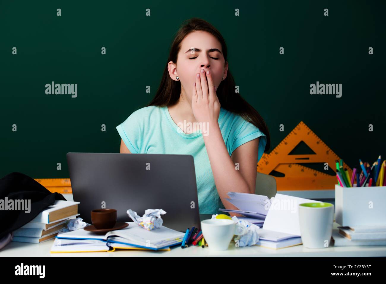 Student sleeping during a lecture in a classroom. Portrait of tired ...