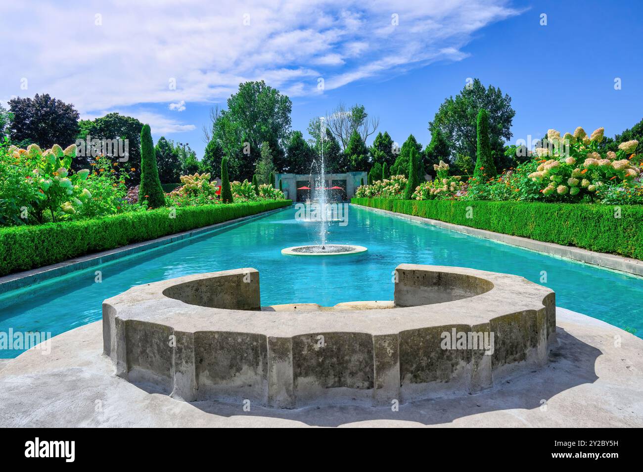 Stone structure in a fountain with flowing water in the formal gardens ...