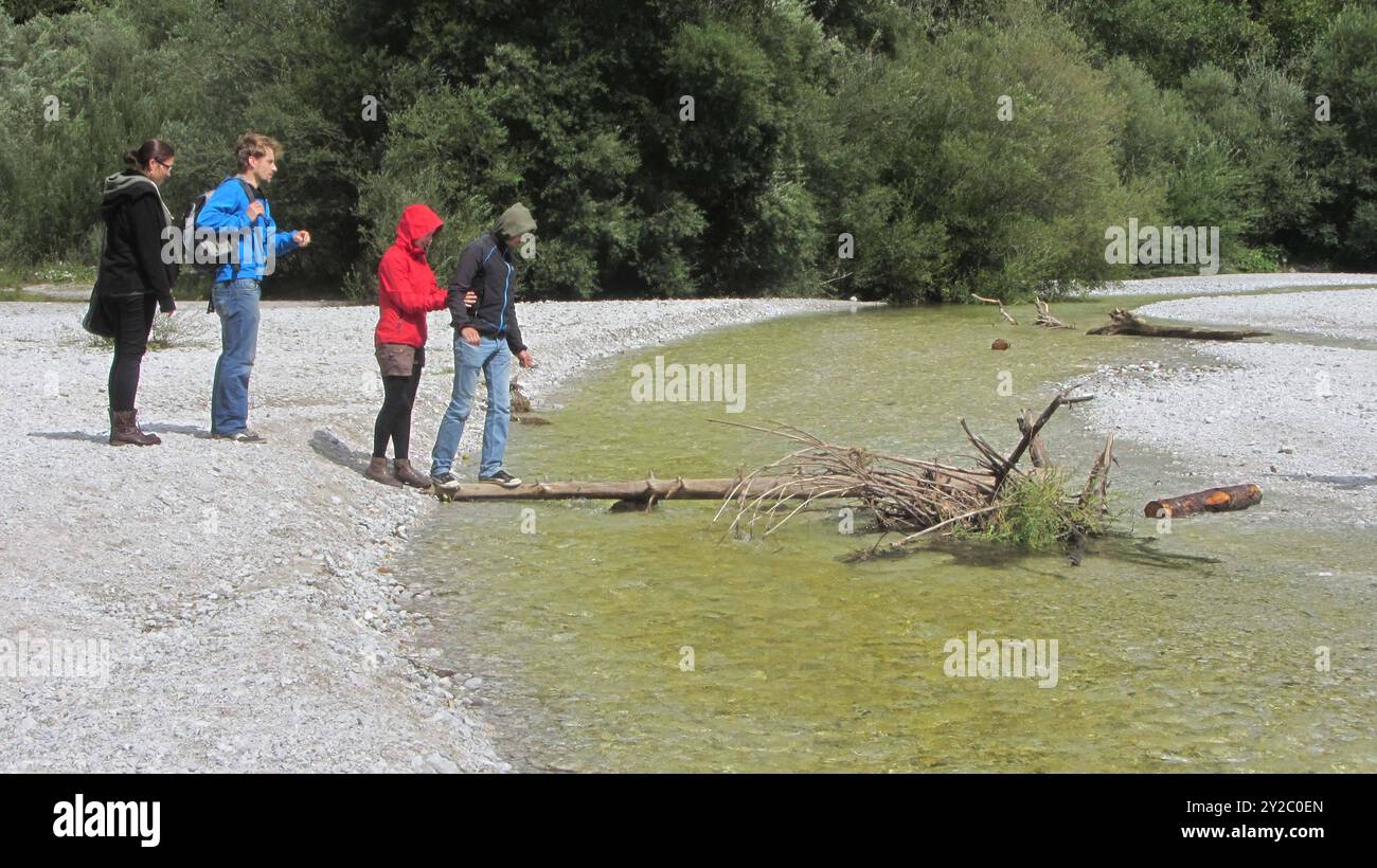 river hike in the mountains of the alps, outdoor activity river hike in ...