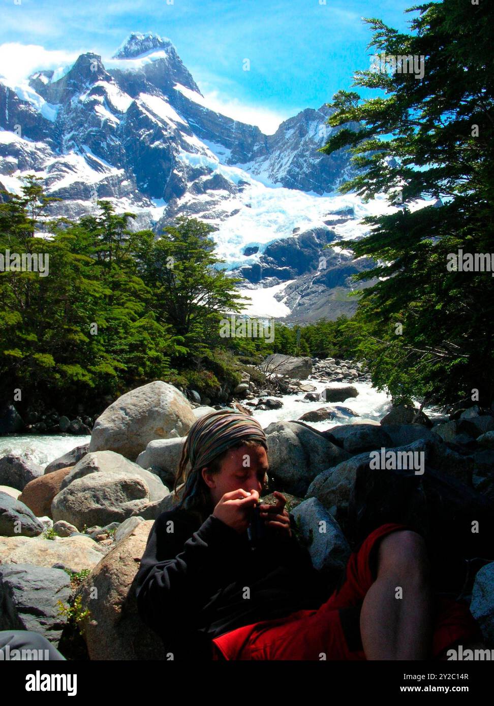 taking a break at hiking, outdoor activity in the mountains taking a ...