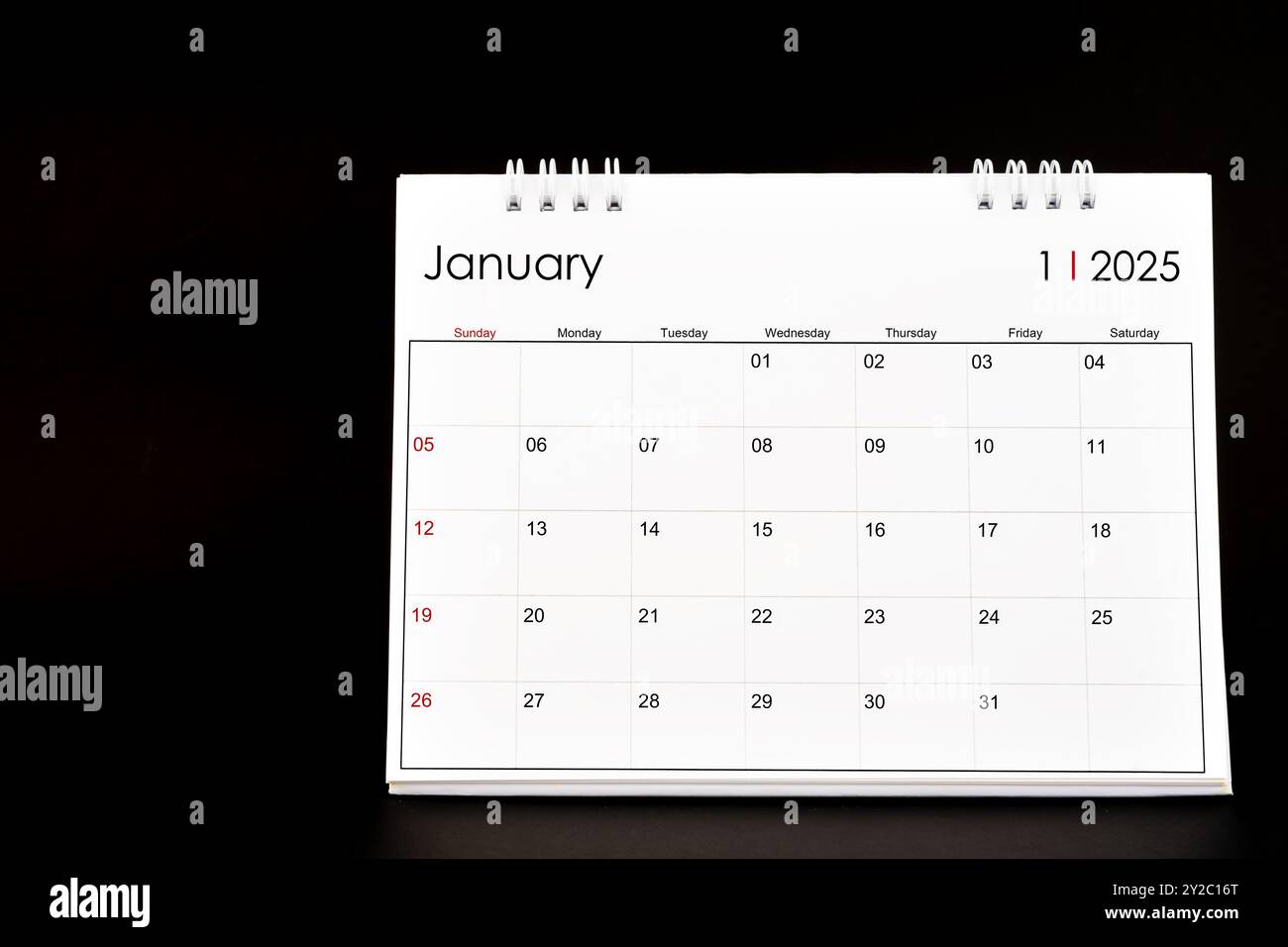 Desk Calendar for January 2025. Desktop calendar on a black color ...