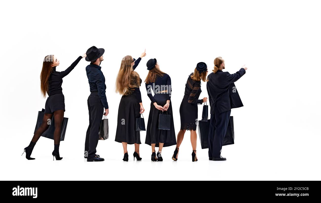 Group points forward in unison, as if directing their collective ...